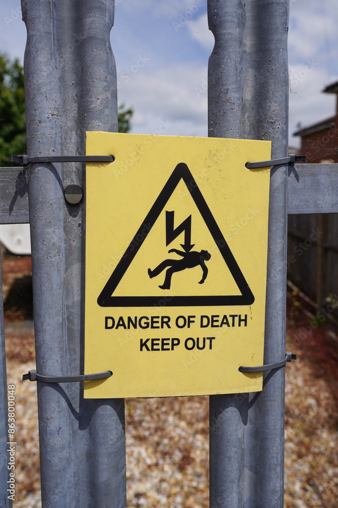 Keep Out, Danger of Death sign on security fence of electric substation ...