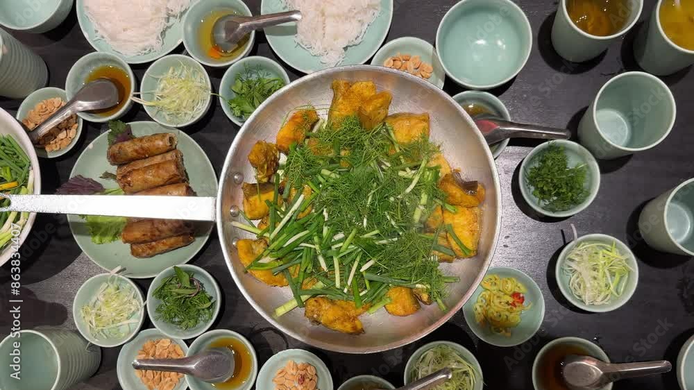 Vietnamese fried spring rolls Cha Gio, with a dish of boneless grilled ...