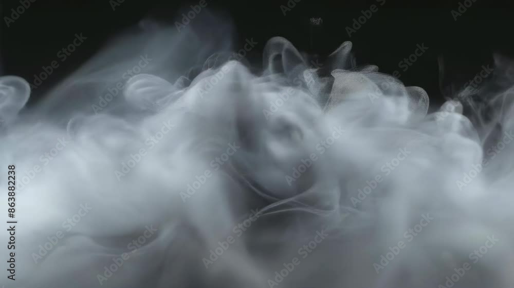 Dense white smoke billows against a dark backdrop, creating a mysterious and eerie mood. No ...