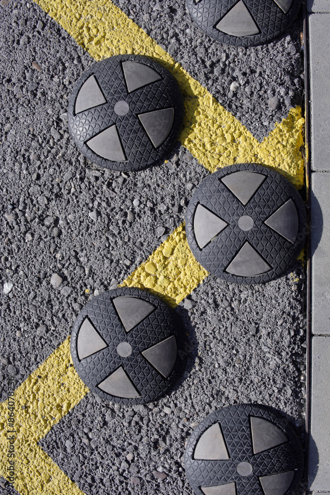 circular speed bumps in the street Stock Photo | Adobe Stock