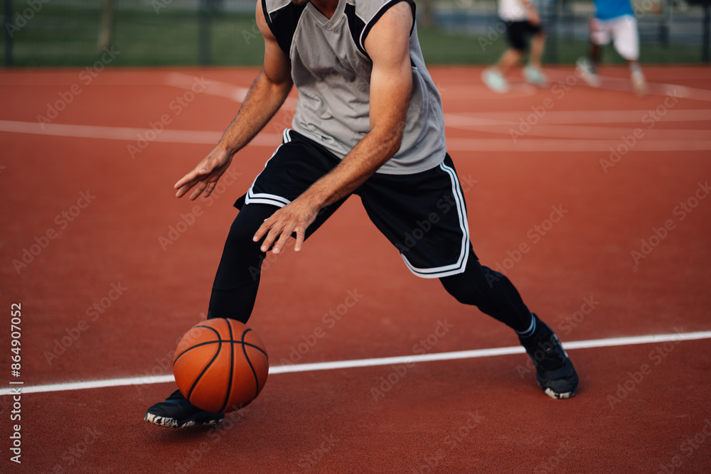 Basketball player doing a crossover Stock Photo | Adobe Stock