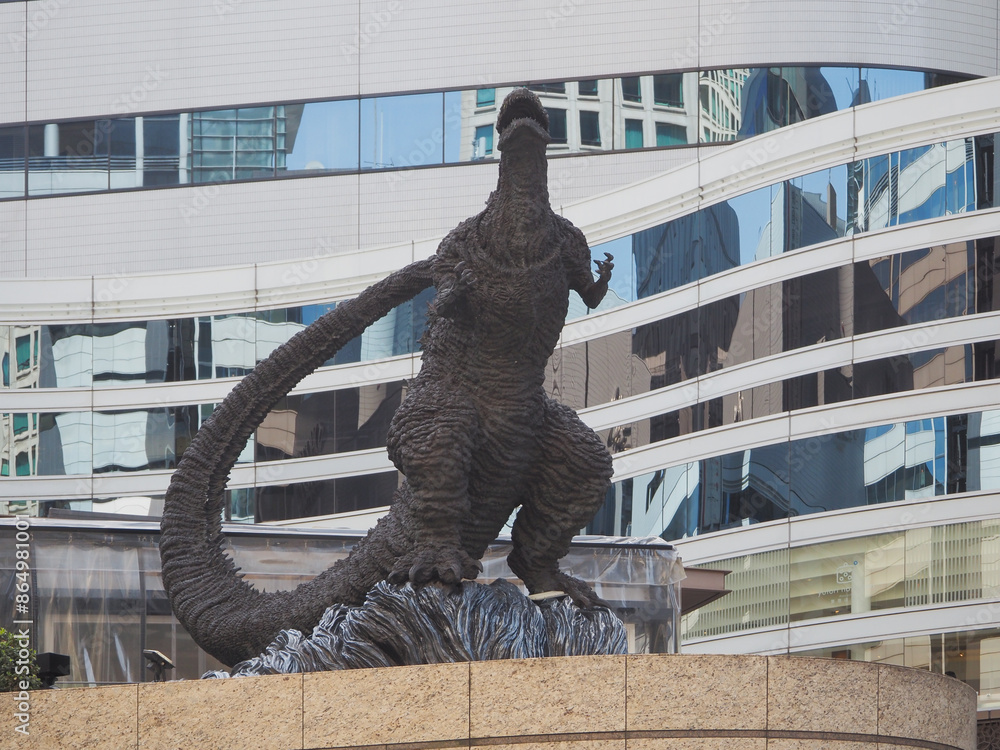 TOKYO, JAPAN - March 31, 2024: A statue of Godzilla in Godzilla Square ...