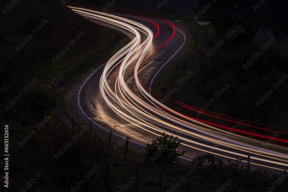 Vehicle headlights light line on the winding road, Süllü, Giresun ...
