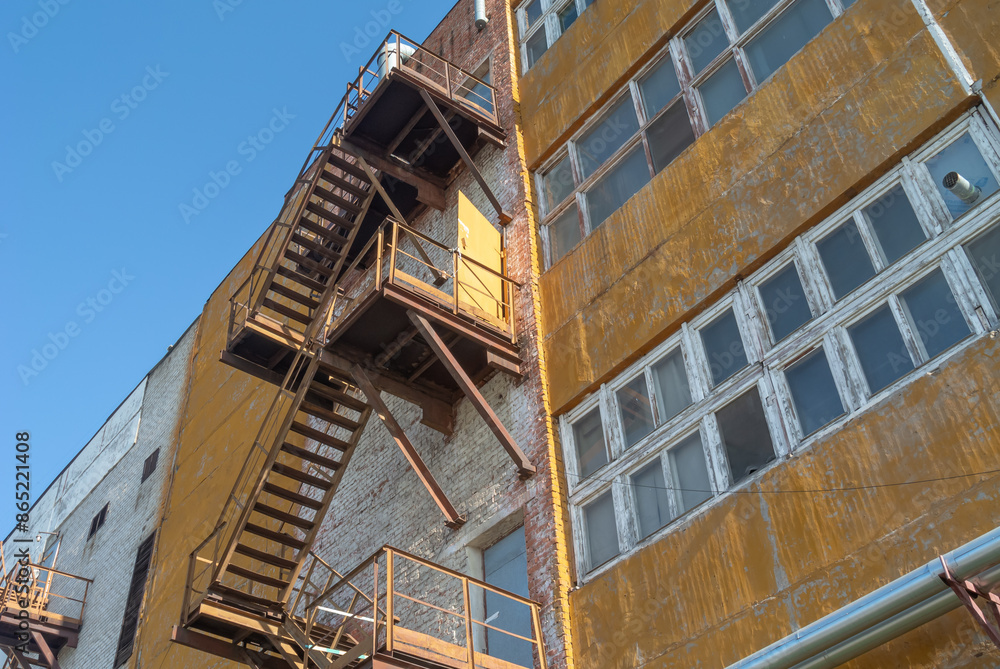 External steel stairs of industrial buildings. Evacuation ladders of ...
