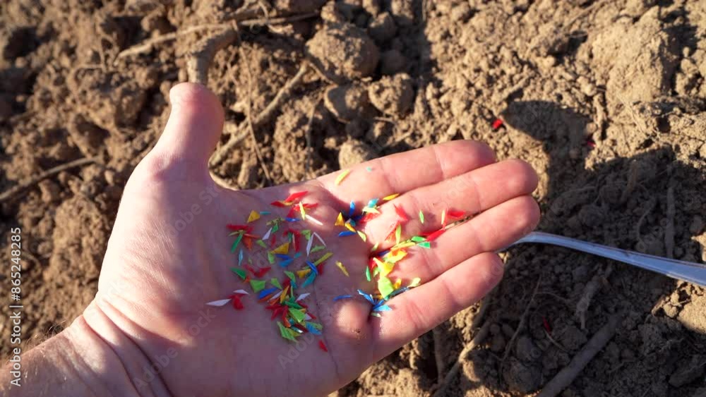 Microplastic pollution. Microplastics in ground. Soil contaminated with ...