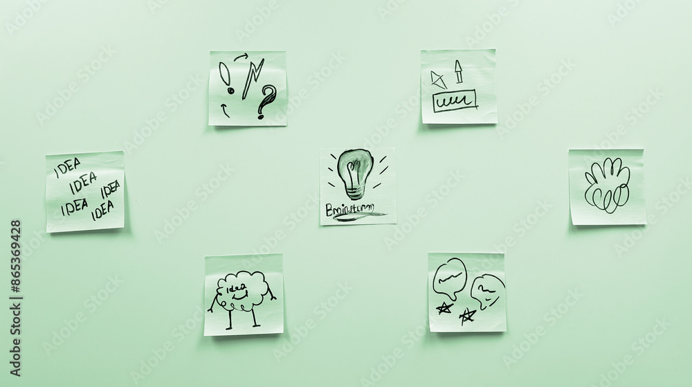 Brainstorm, background in green colors. Ideas are depicted on sticky ...