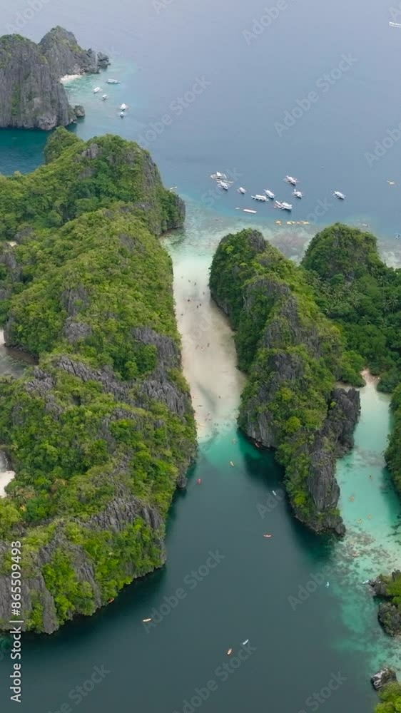 Beautiful Lagoons with tourist boats and kayaks in Miniloc Island. El ...