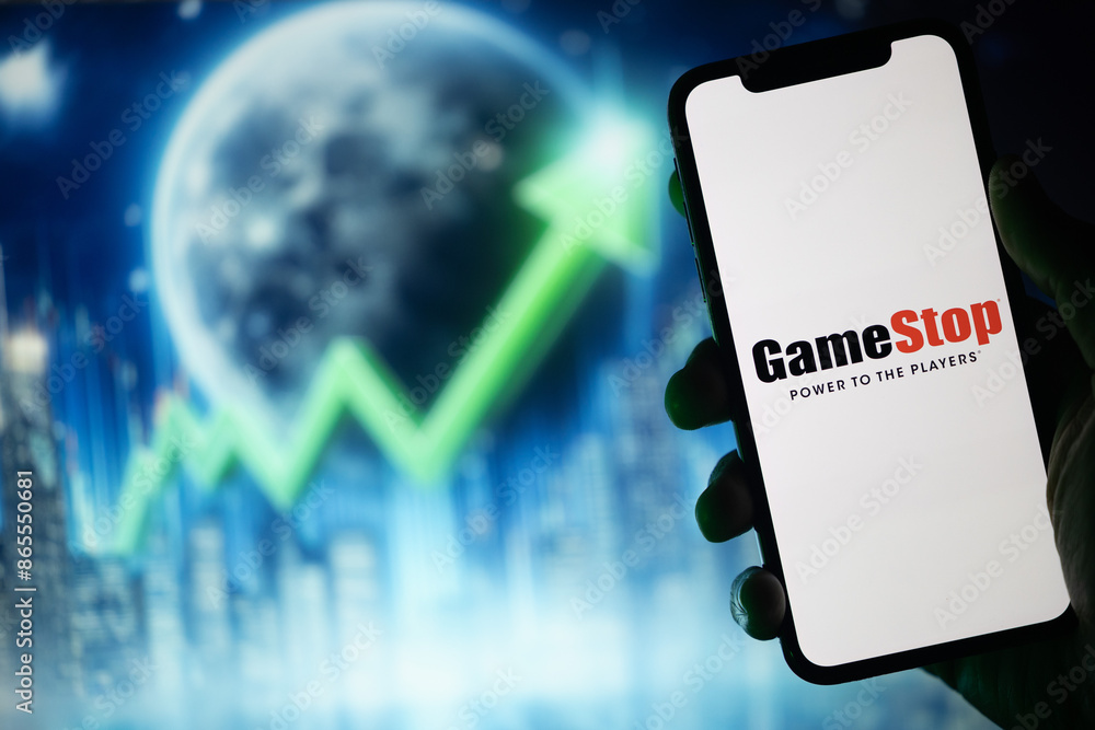 Porto, Portugal - April 30, 2024: In silhouette, a hand holds a mobile ...