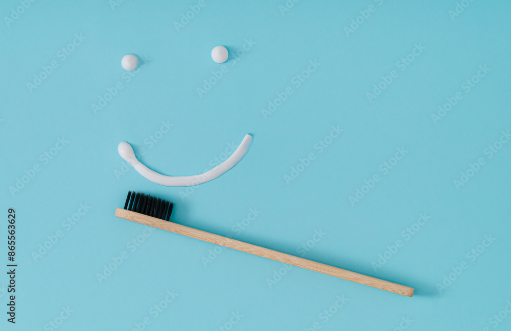 Organic bamboo toothbrush and white medical toothpaste making smile ...