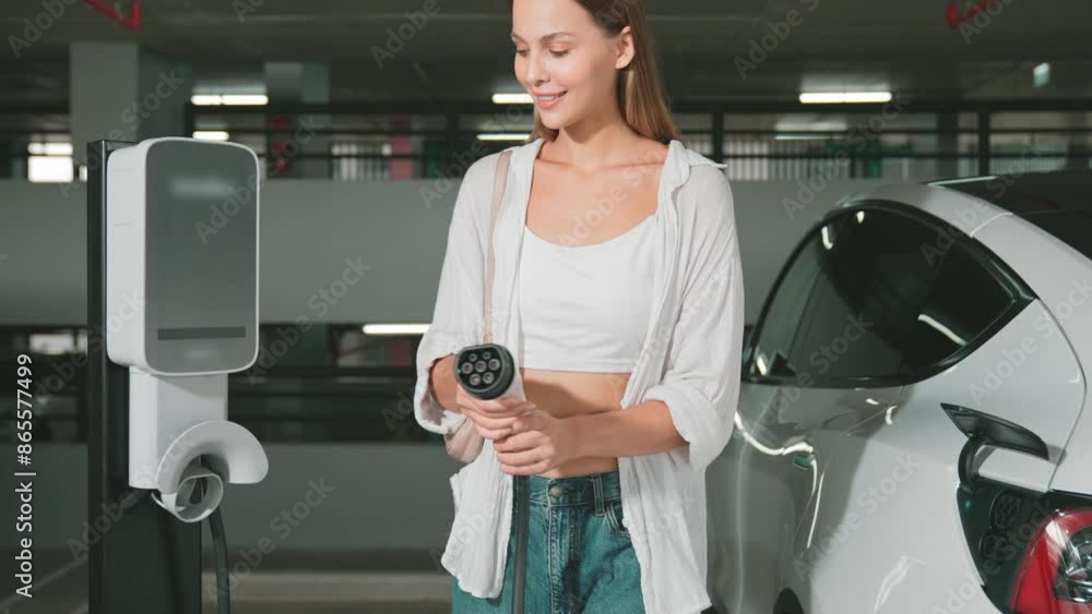 Slow motion woman happy and smile travel with EV electric car to shopp ...