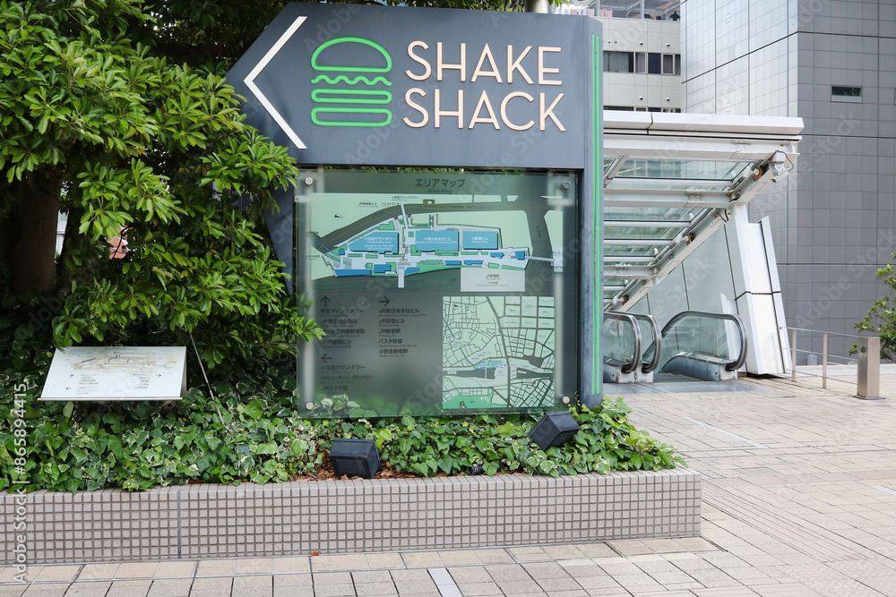 TOKYO, JAPAN - June 4, 2024: A Shake Shack sign above an area map near ...