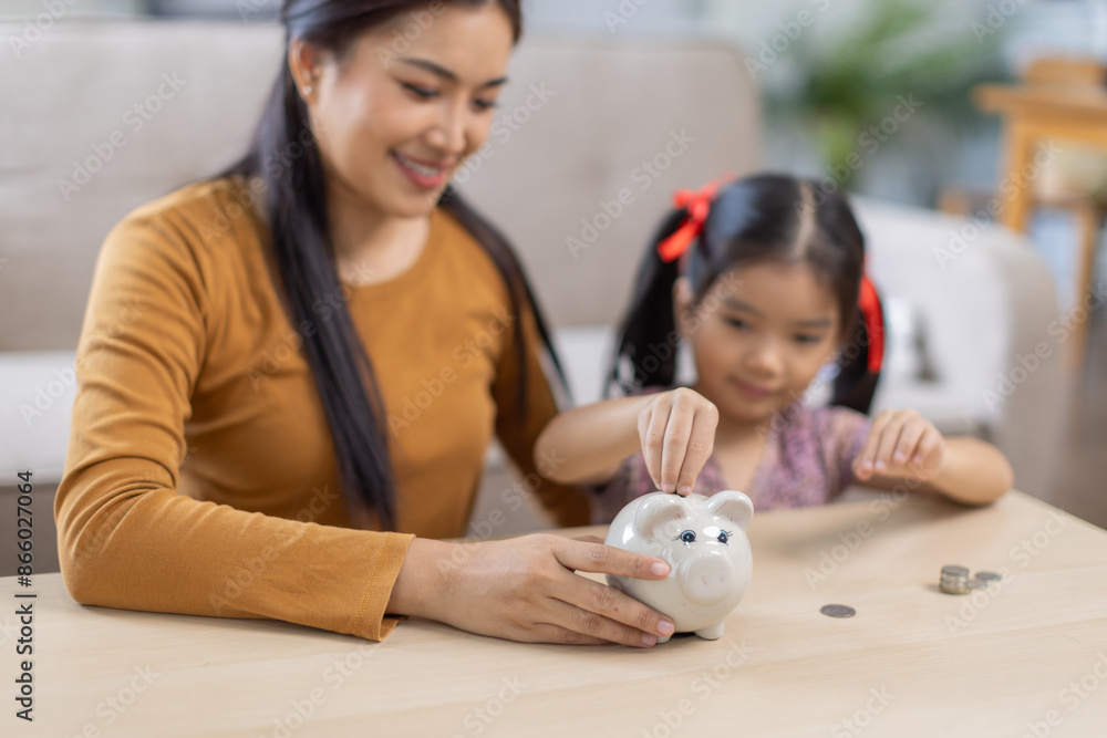 Setting good example. Young parent mother teach child little daughter ...