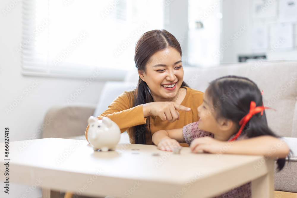 Setting good example. Young parent mother teach child little daughter ...