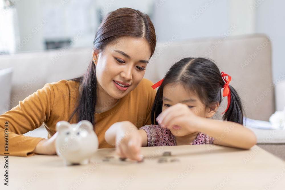 Setting good example. Young parent mother teach child little daughter ...