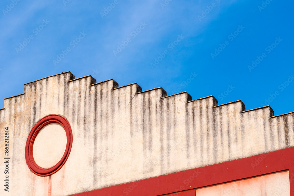 stepped gable wall detailed with a circular red window accent, offering ...