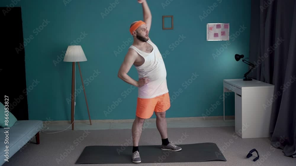 Handsome man raising hand bending to side, doing stretching muscle ...