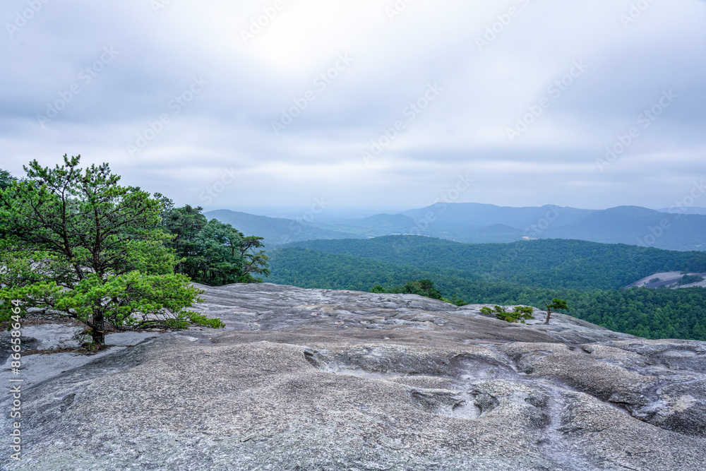 The summit of Stone Mountain showcases a vast expanse of bare rock ...