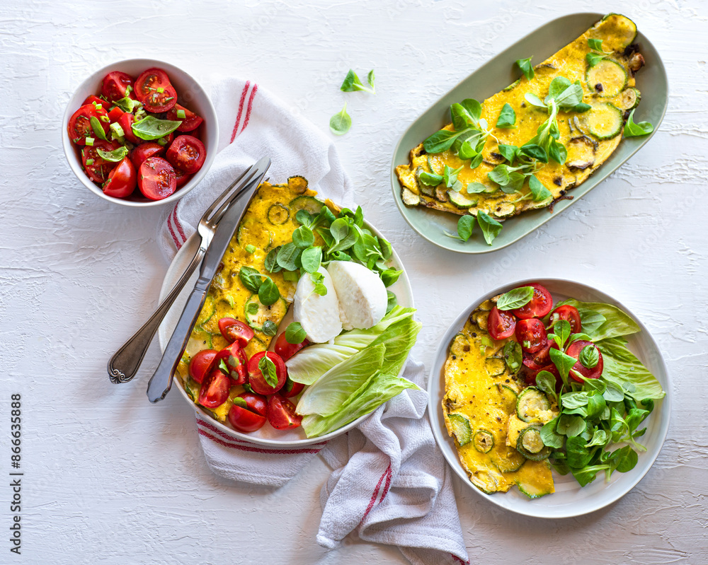 Mozzarella Bufala, omelet with zucchini, salad with tomatoes and basil ...