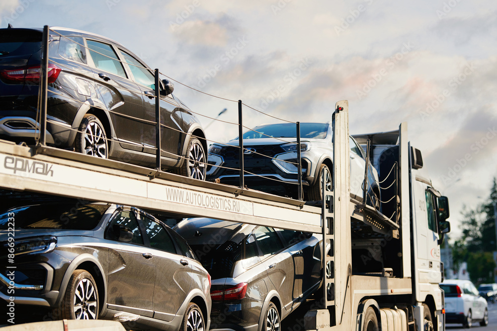 Minsk, Belarus. Jun 8 2024. Car carrier hauls new cars Lada Vesta Cross ...