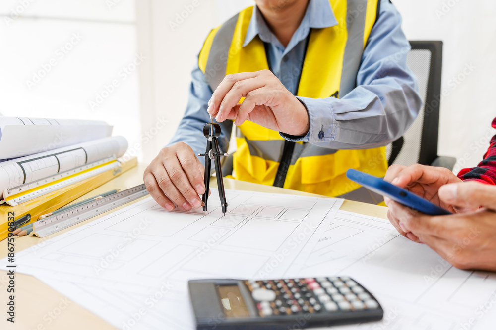 Two men, including a male Asian construction contractor engineer ...