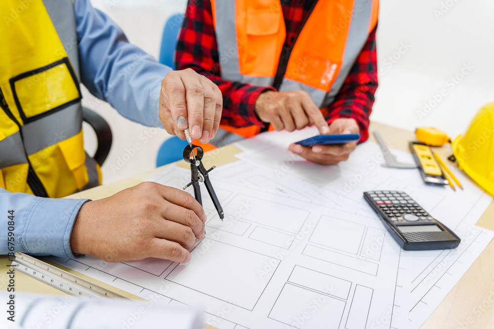 Two men, including a male Asian construction contractor engineer ...