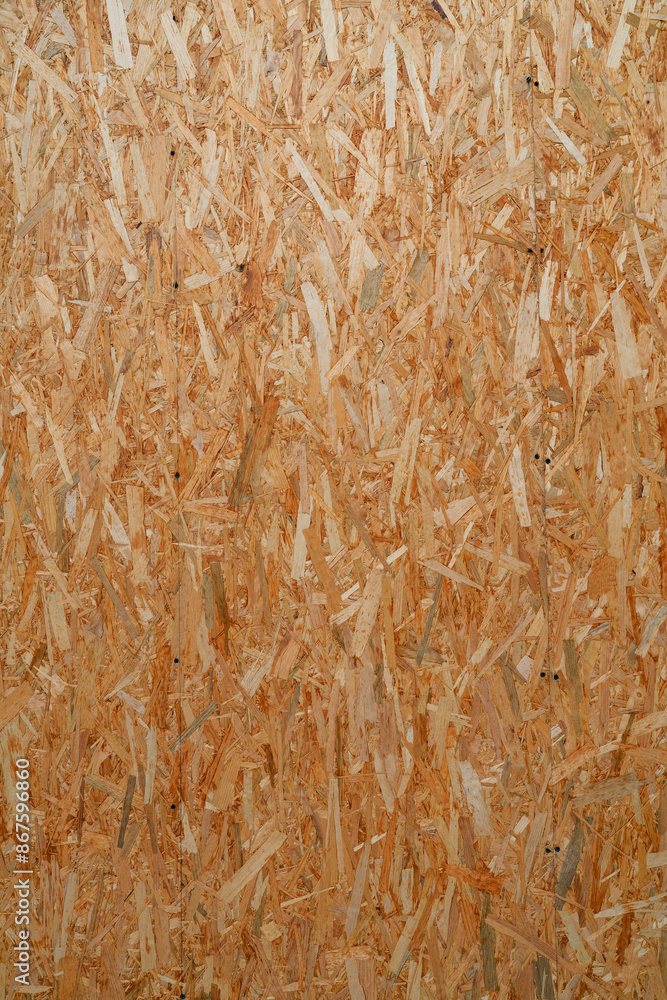 Close up pressed wooden panel background, seamless texture of oriented ...