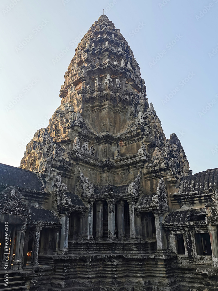 Iconic Angkor Wat temple in Cambodia, illuminated by evening light ...