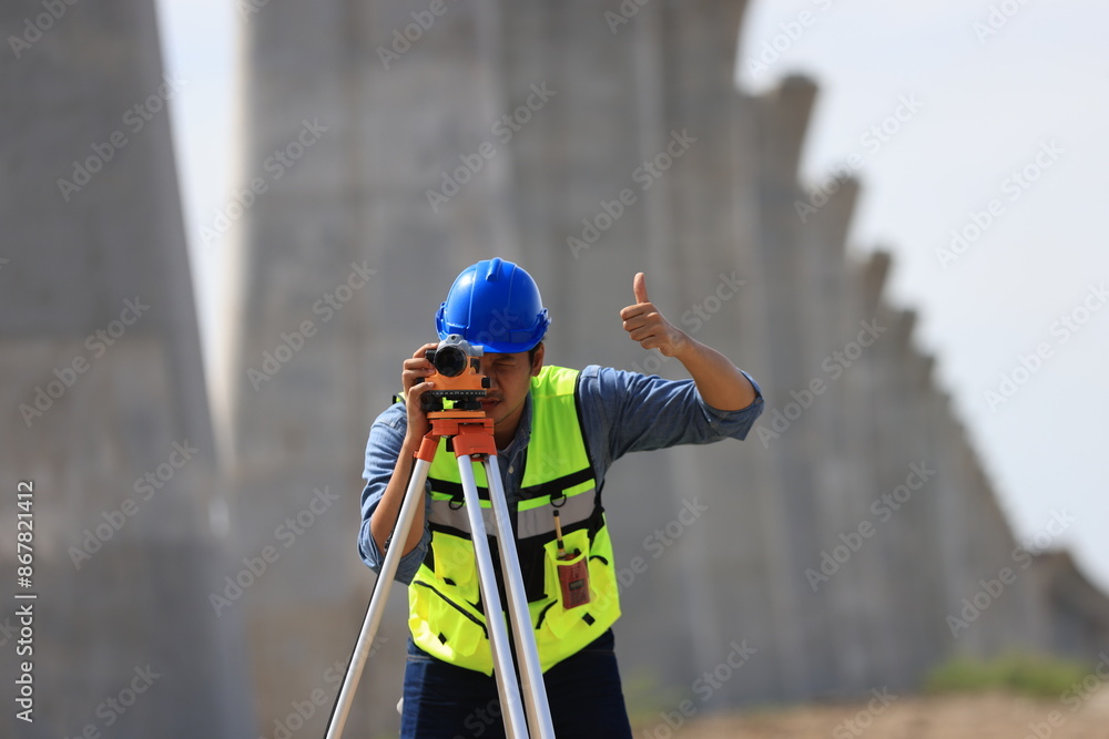 survey engineer with a surveyor's telescope to explore the construction ...