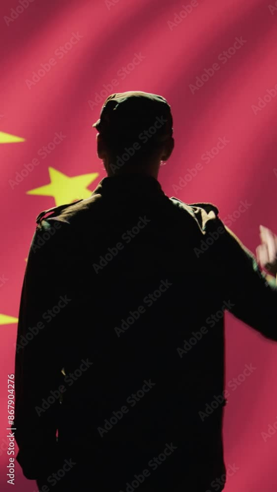 Vertical video Member of chinese army doing saluting hand gesture ...