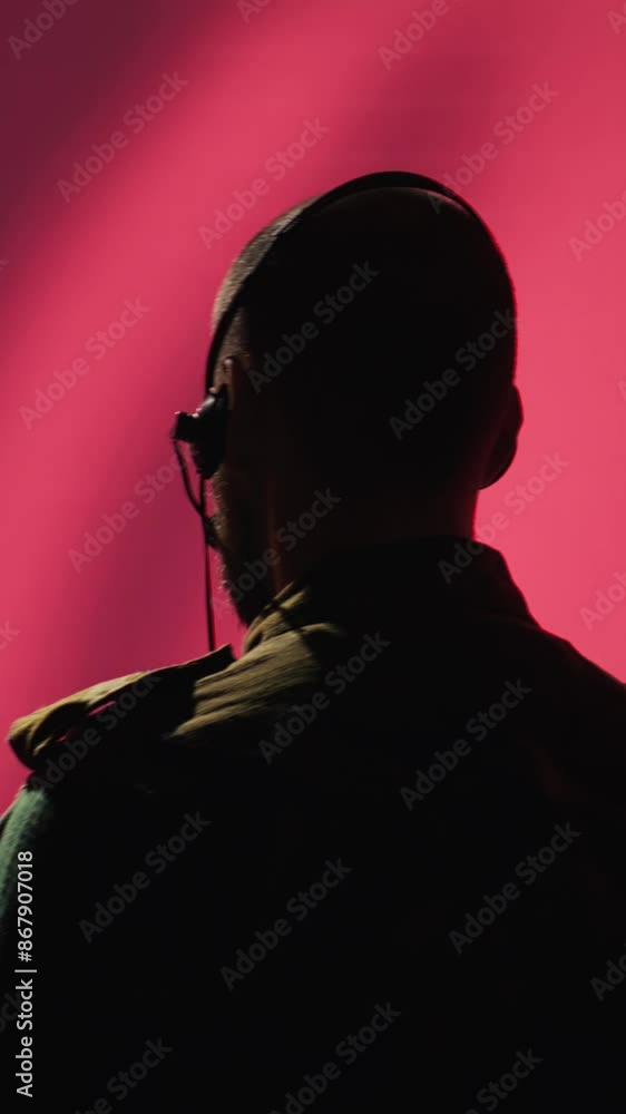 Vertical video Military dispatcher working for Chinese army relaying info for troops using ...