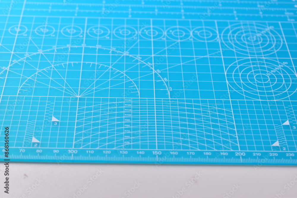 blue cutting mat board on white background with line and scale measure ...