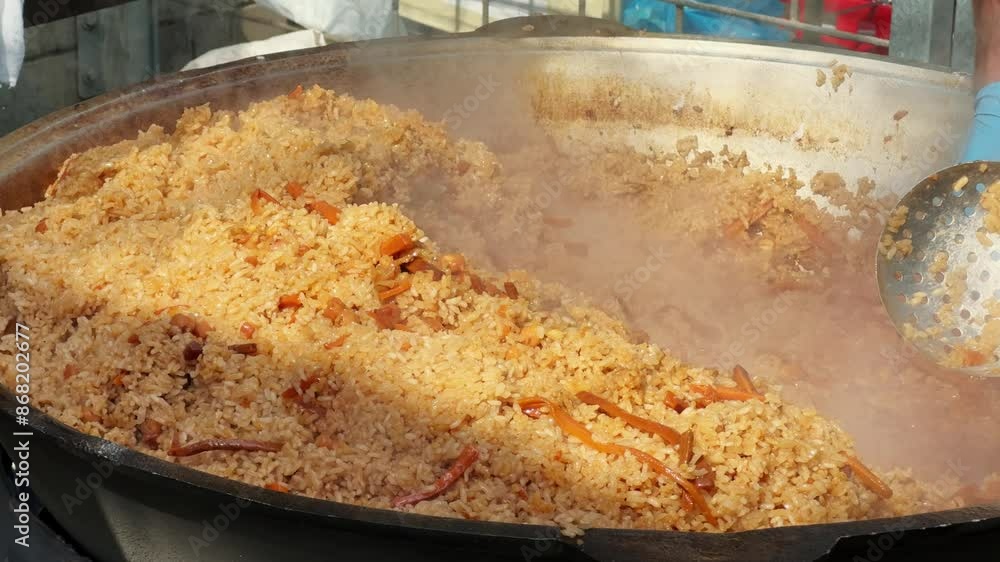 Uzbek plov pilaf close up. The signature dish of Uzbekistan is cooked ...