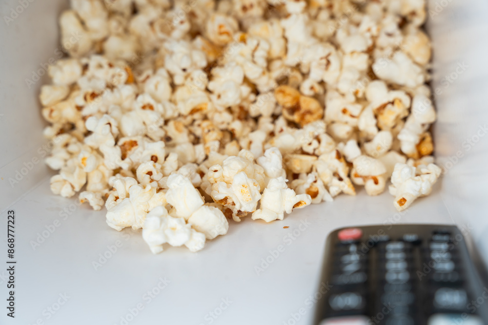 Home Cinema: Popcorn and TV Controller: Inside view of a white popcorn ...