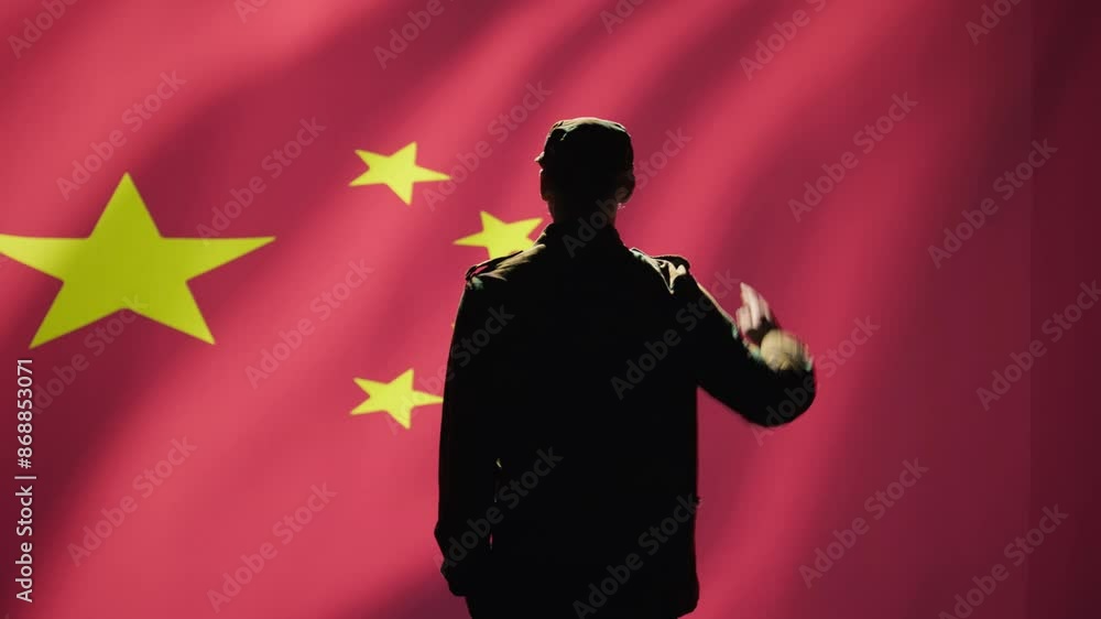 Member of chinese army doing saluting hand gesture towards China flag ...