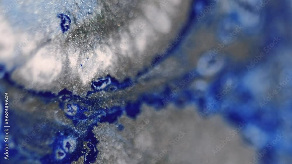 Paint splash. Glitter fluid mix. Blur blue silver color shiny ...
