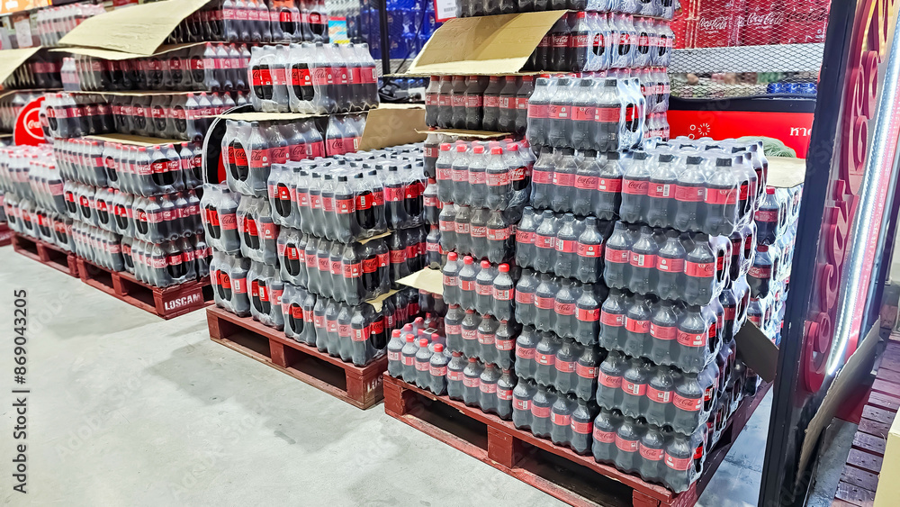 Plastic bottles display of Coke Coca-cola on display piled in multiple ...