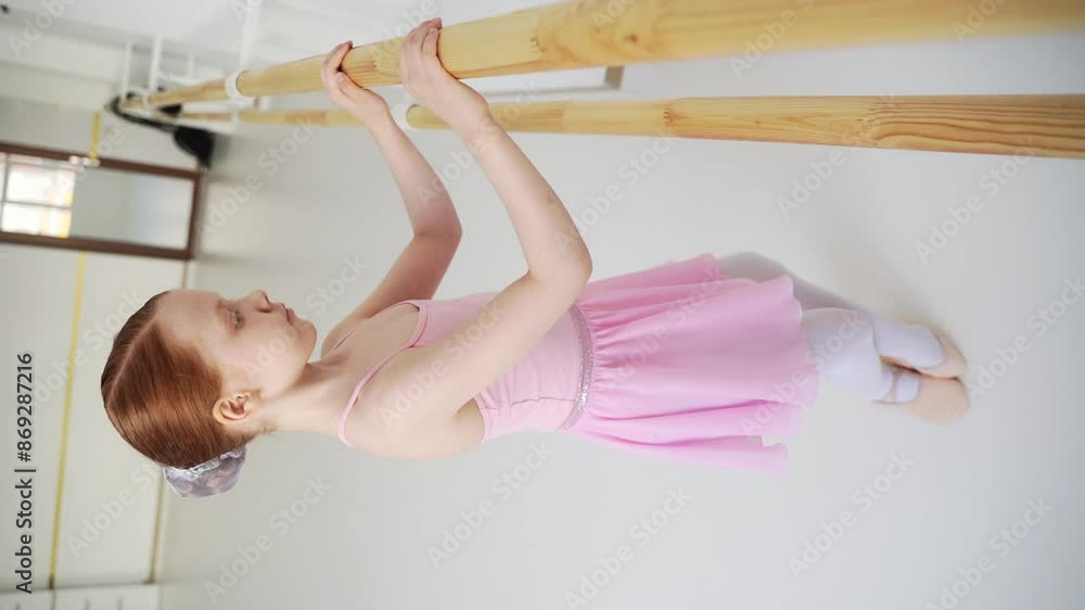 Young ballet girl at studio lesson. Training performance. Stretching ...