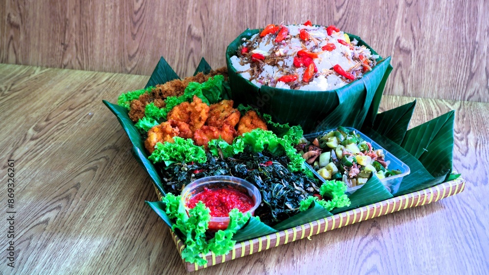 Nasi liwet is a typical Indonesian rice dish cooked with coconut milk ...