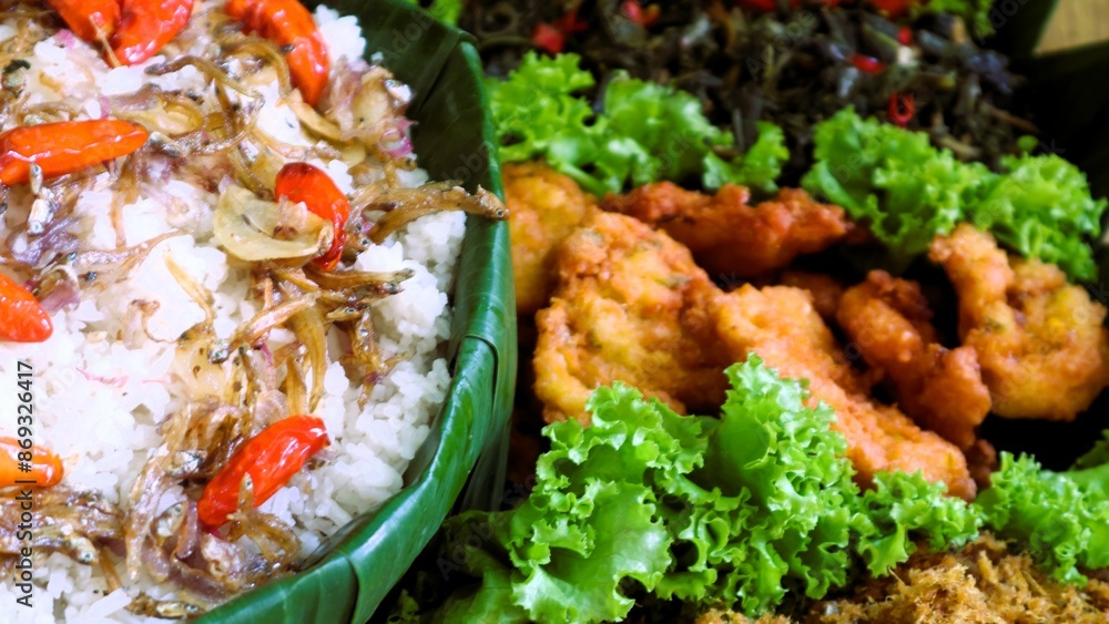 Nasi liwet is a typical Indonesian rice dish cooked with coconut milk ...