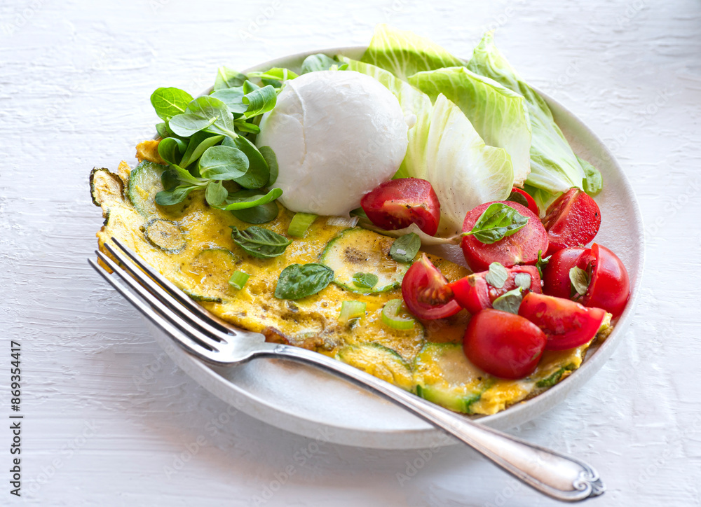 Mozzarella Bufala, omelet with zucchini, salad with tomatoes and basil ...