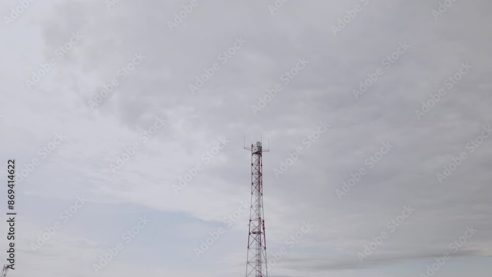 Mobile receiver and transmitter antenna tower,antenna tower building with the blue sky.Close-up ...