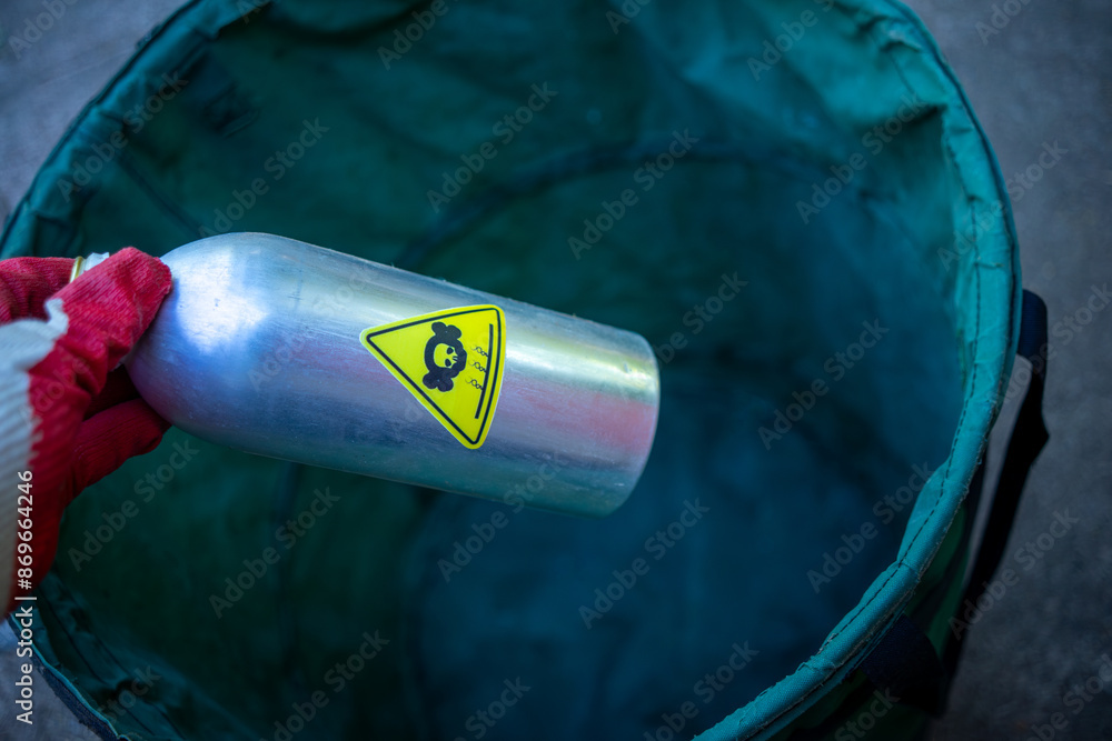 Disposal of hazardous waste.A bottle of poisonous liquid in his hand ...