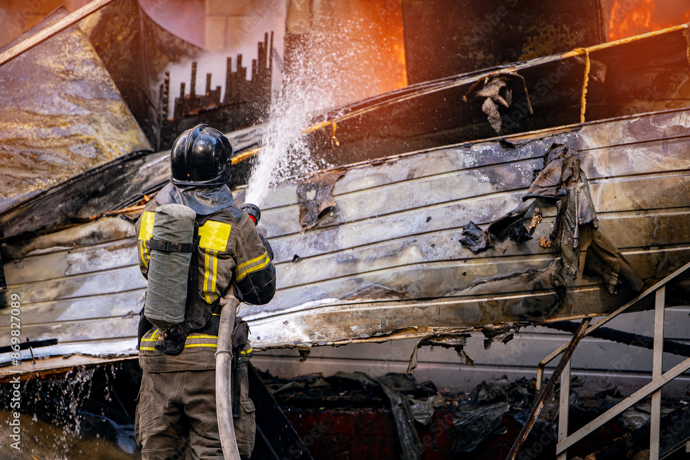 Fire incident in building. Action photo fireman team extinguishes burn ...