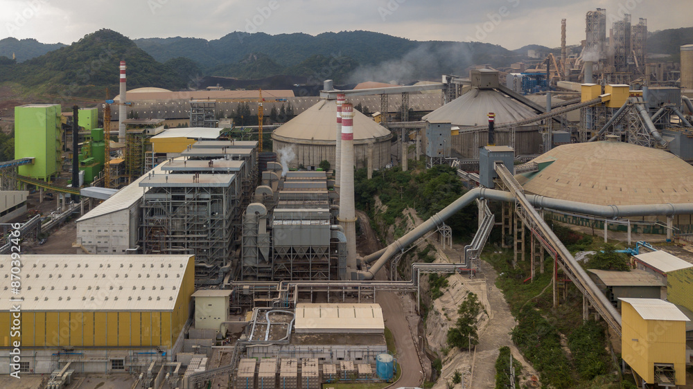 Aerial view cement factory, Cement product plant silo towers, pipes ...
