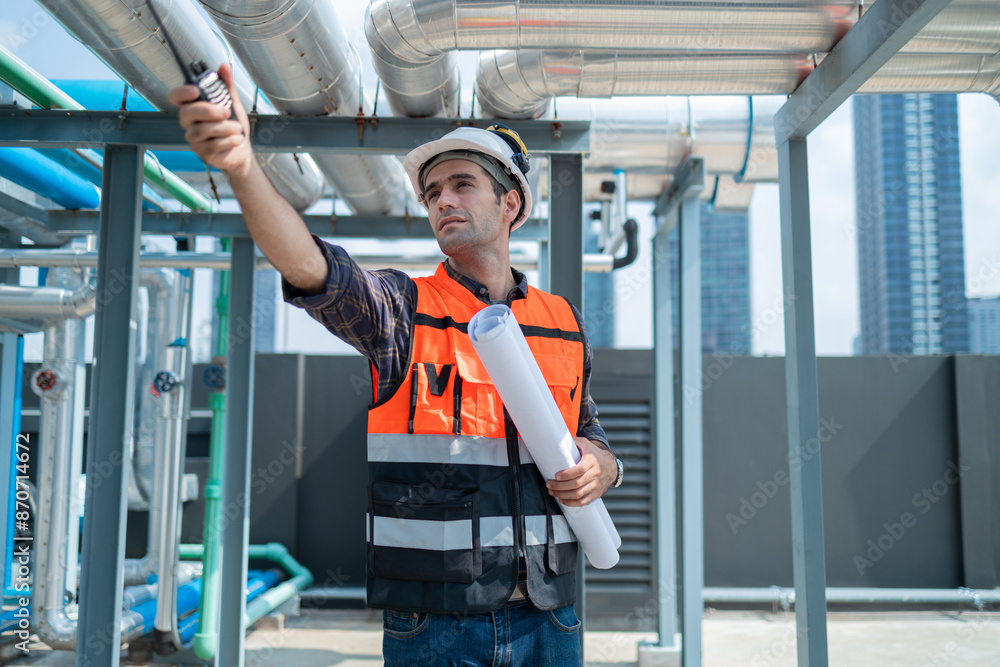 Engineer under checking the industry chilled water fan coil unit air ...