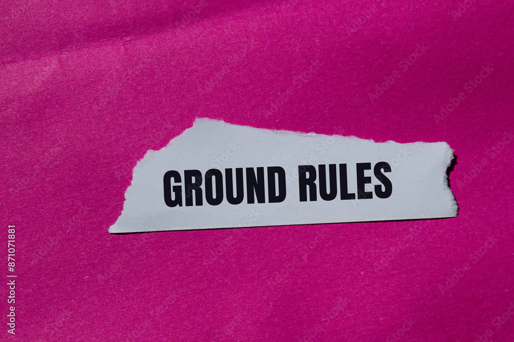 Ground rules message written on ripped white paper piece with pink ...