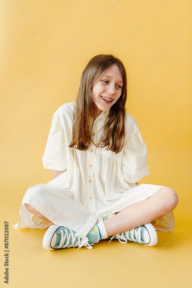 Quiet, shy tween girl sitting portrait Stock Photo | Adobe Stock