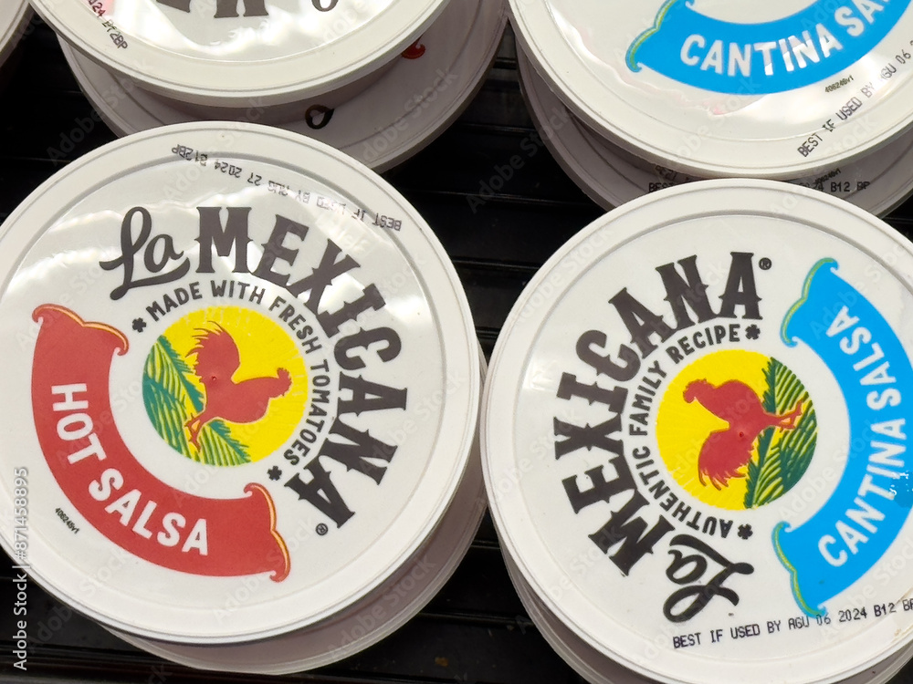 La Mexicana containers of Mexican salsa in a supermarket. Seen on July ...