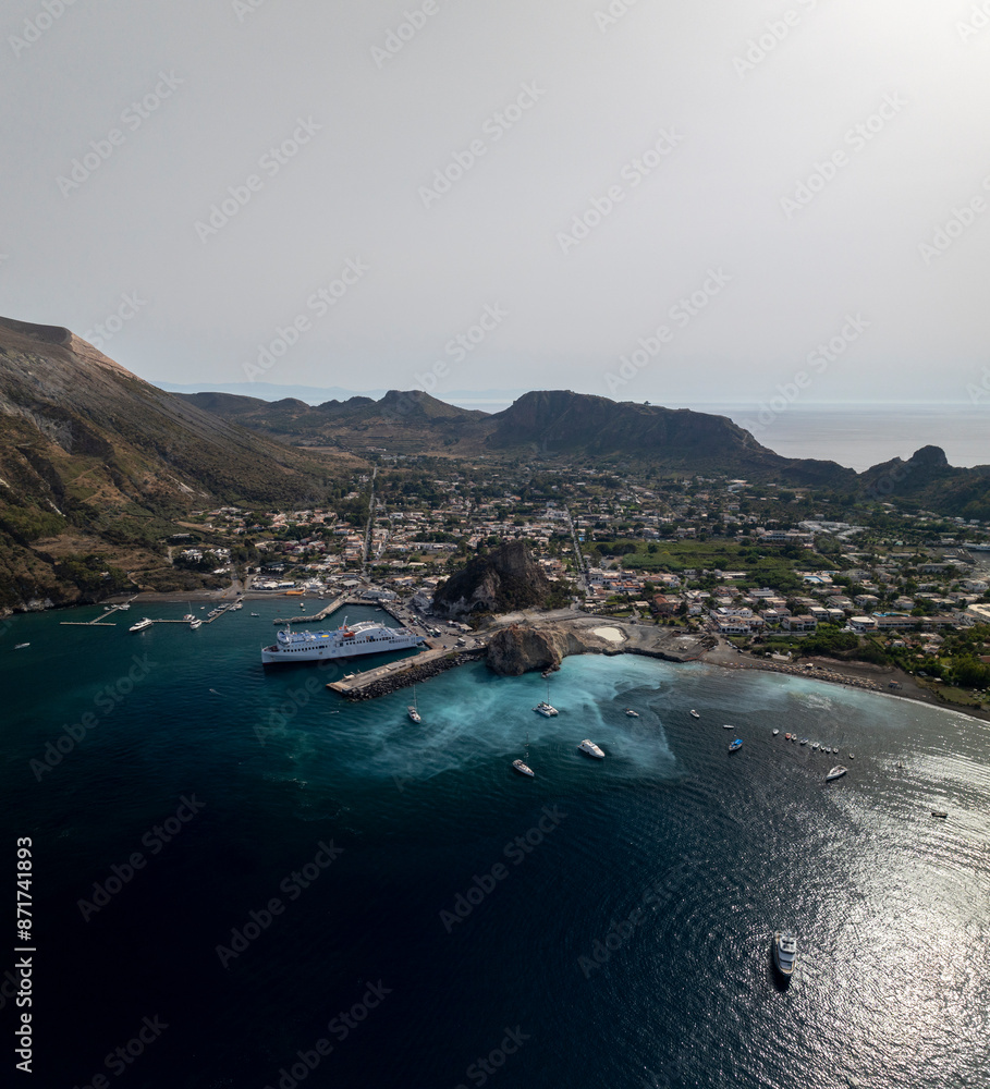 Aerial view of Vulcano Port on Vulcano island with sulfur water along ...