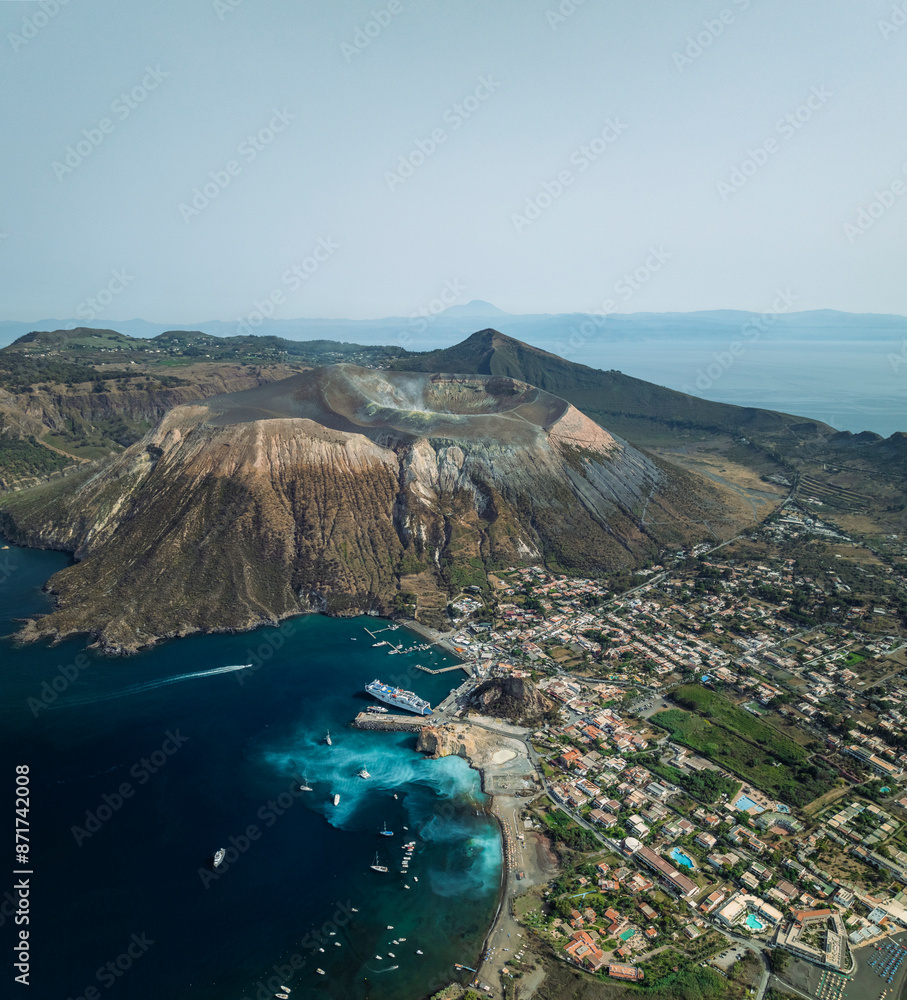 Aerial view of Vulcano Port on Vulcano island with sulfur water along ...